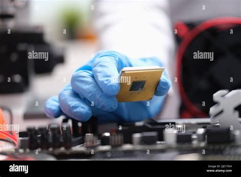 Technician Put Processor On Computer Motherboard Socket Stock Photo Alamy