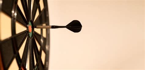 Premium Photo A Darts Game An Arrow The Center Of The Target The Target Is Hit In The Center