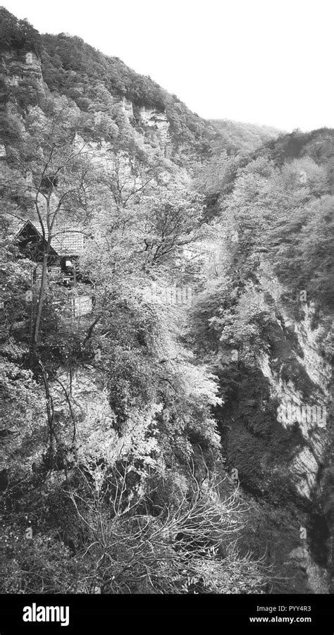 An Isolated House Atop Of A Cliff In Canyon Black And White Stock