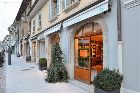 Download Scenic View Of Carouge Cityscape At Sunset Wallpaper