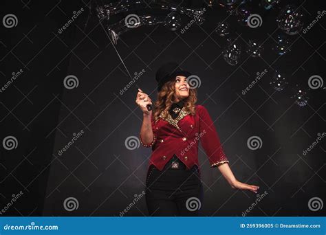 Female Magician Makes With Soap Bubbles Show An Illusionist Stock