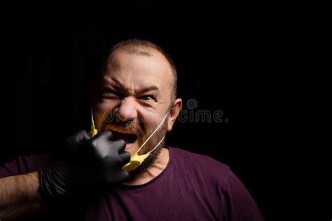 A Man Rips Off A Medical Mask Screaming Man Black Background Stock