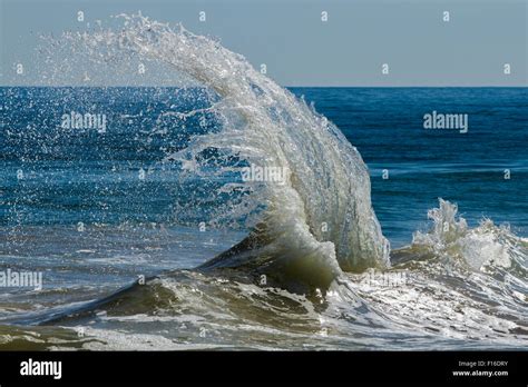 Two Waves Colliding Together To Cause A Beautiful Water Feature Stock