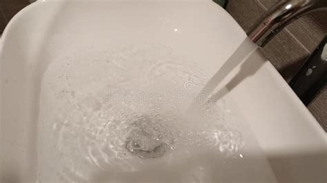 A Steady Flow Of Clear Water Flows From The Tap Into The Sink Stock Footage Video Of Flow