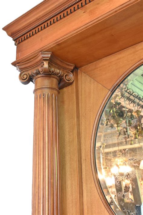 maple mantel with beveled mirror and full height columns