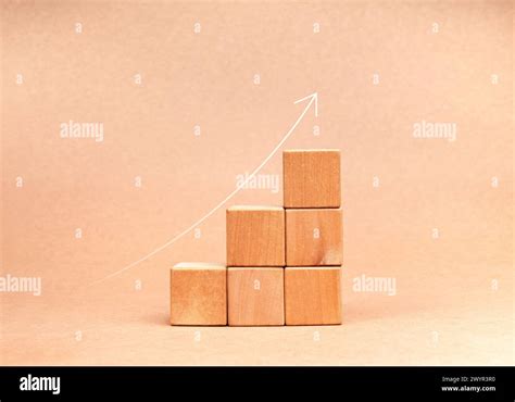 Rising Up Thin Arrow On Wooden Cube Blocks Minimalist Bar Graph Chart Steps On Brown Recycle