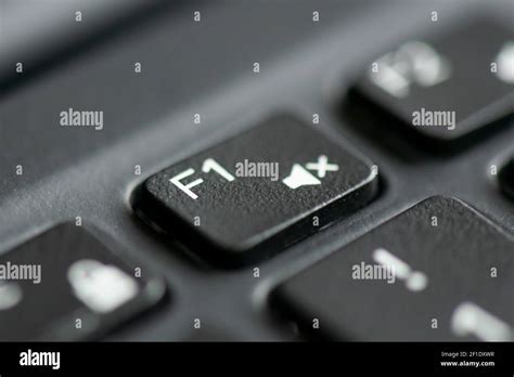 F1 And Mute Volume Key On A Laptop Keyboard Stock Photo Alamy