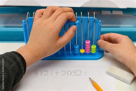 Kid Using Abacus To Calculate Addition Equation Stock Photo Adobe Stock