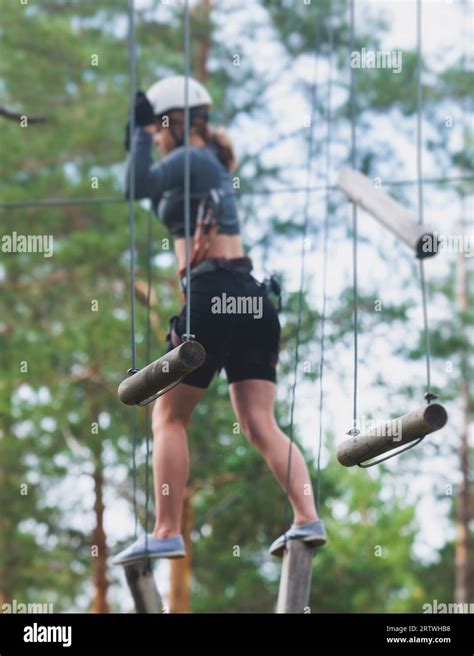 View Of High Ropes Course Process Of Climbing In Amusement Acitivity