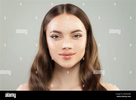 Grid Of Lines Showing Facial Lifting Effect On Fresh Skin Of Beautiful Young Woman With Healthy