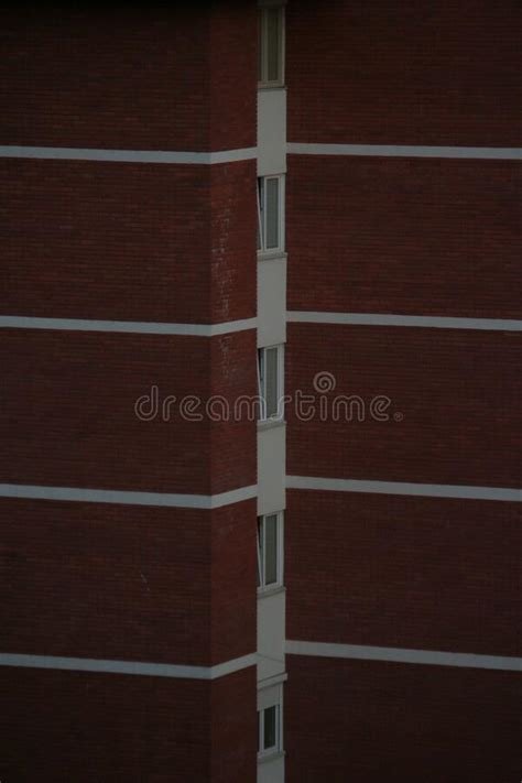 Vertical High Angle Of Brown And White Cladding Brick Apartment Blocks