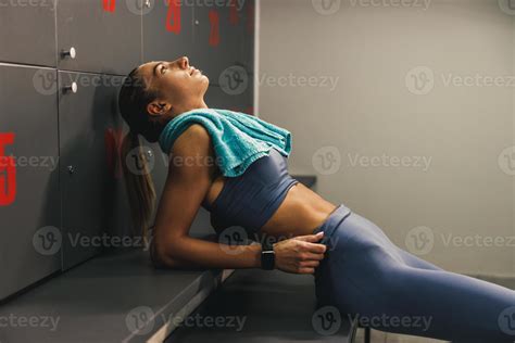 Woman Resting In Locker Room After Training At The Gym 14233255 Stock