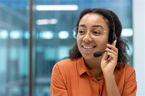 woman working in customer service with a headset in a modern setting