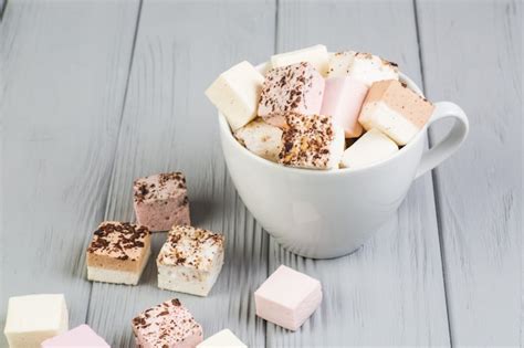 Premium Photo Assorted Marshmallow On A Gray Table