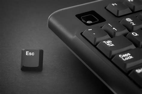 escape key escapes from a black computer keyboard the swiss quality