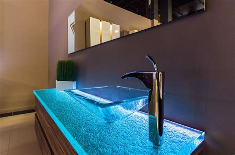 Make Your Bathroom Unique With A CBD Glass Countertop And A Crystal Vessel On Top Shown In Aqua