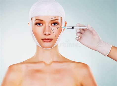 Female With Medical Bandages Doctor`s Hand Gives Botox Injection Using A Syringe Stock Image
