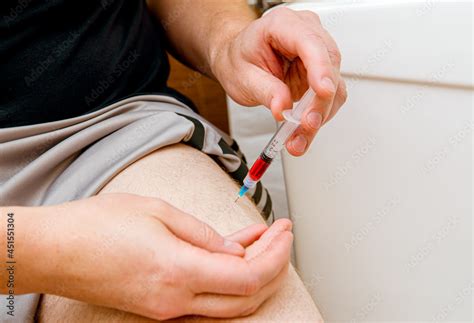 Close Up View Of Man Person Do The B12 Vitamin Injection Shot In Home