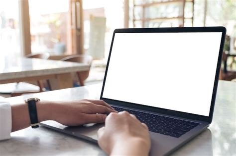 Premium Photo Mockup Image Of Hands Using And Typing On Laptop With Blank White Desktop Screen