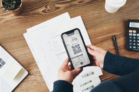 premium photo paying invoice scanning qr code from document using