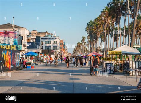 Venice Beach Boardwalk With Palm Trees And Graffiti Art In Los Angeles