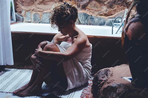 Premium Photo Adult Woman Sitting On The Floor In Bathroom At Home