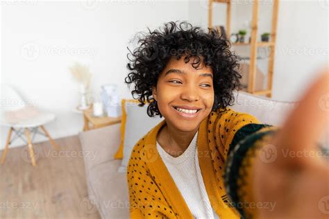 Happy African American Teen Girl Blogger Smiling Face Talking To Webcam