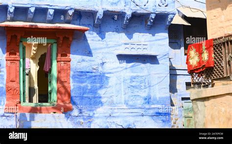 Stunning View Of A Colorful Window Of A House Among The Narrow Streets Of The Blue City Of