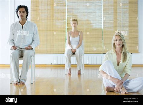 Group Meditation Adults Sitting In Different Positions Stock Photo Alamy