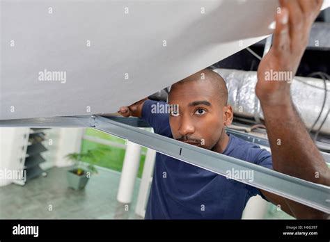 Replacing A Ceiling Tile Stock Photo Alamy