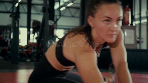 A Girl In The Gym Trains Young Woman Is Engaged In Simulators In The