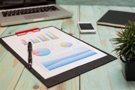 Photo Diagrams Graphs And Numerals In The Table On The Paper Stock Photo Image Of Investment