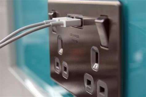 Premium Photo Closeup Of A White Usb Cable Plugged Into A Socket