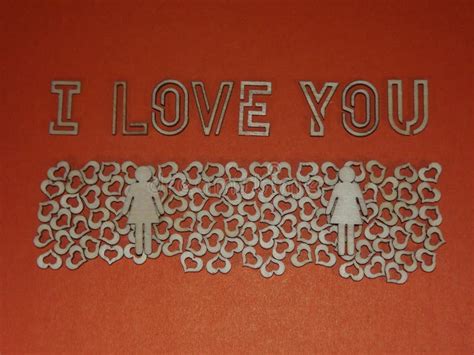 Lgbt Same Sex Love Between Two Women The Image Of Wooden Figures Of Women Among Hearts Stock