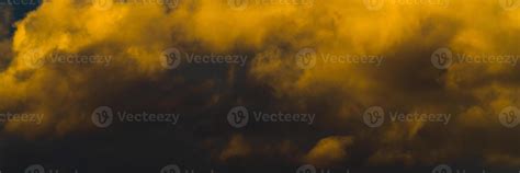 Fluffy Clouds Illuminated Disappearing Rays At Sunset Floating Across