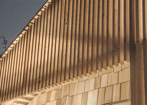 Light Glows Through The Cedar Facade Of Writers Shed By Wsd