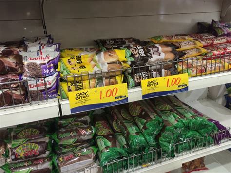 Different Types Of Bread In Commercial Packages Are Displayed On Shelves For Sale Editorial