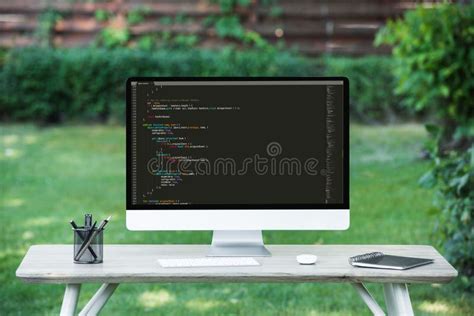 Selective Focus Of Computer Monitor With Programming Language Code At Table Editorial Stock
