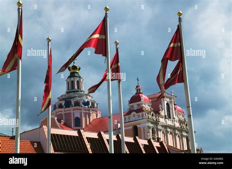Flag Poles And Church Spires In Town Hall Square Vilnius Lithuania