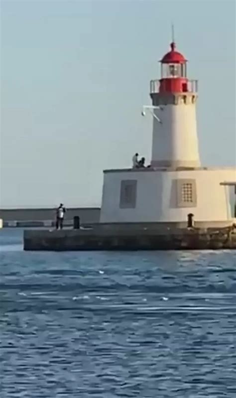 Shocking Moment Couple Romp On Ibiza Lighthouse In Front Of Passing Tourist Boat Daily Star