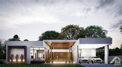 A Modern House With Two Cars Parked In The Driveway And Trees Behind It At Dusk