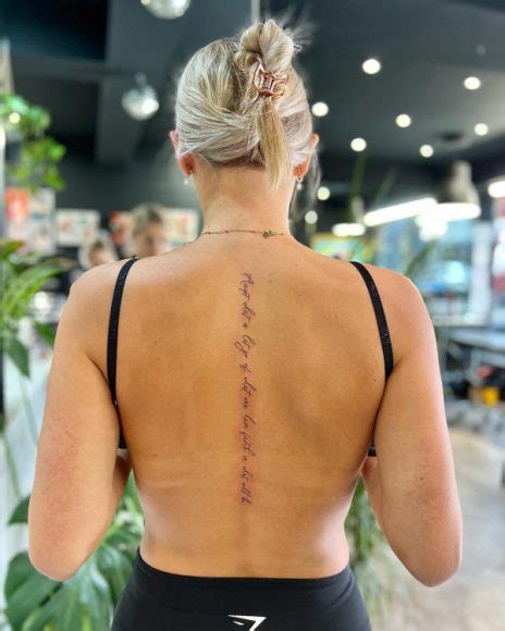 subtle script spine tattoo resilience meaningful back tattoos
