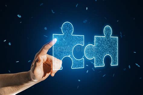 Close Up Of Businessman Hand Pointing At Glowing Digital Blue Jigsaw Puzzle Hologram On Dark