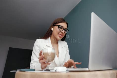 Beautiful Cheerful Woman Sit Indoors In Office Using Laptop Computer