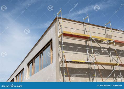 Scaffolding Around The Insulated Wall Facade On Construction Site