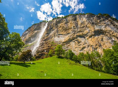 Famous Lauterbrunnen Valley With Gorgeous Waterfall And Swiss Alps In