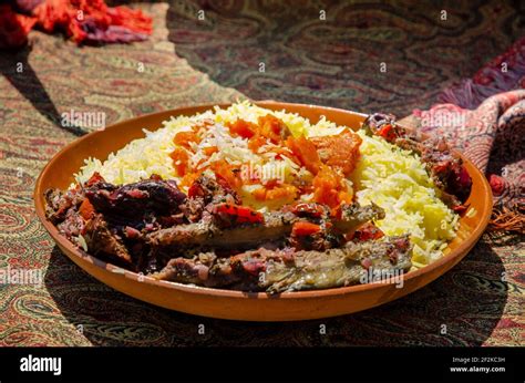 Traditional Caucasian Rice Dish Plov With Dry Fruits And Meat Stock