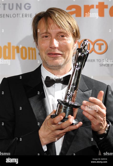 Danish Actor Mads Mikkelsen Poses With His Award During The 24th