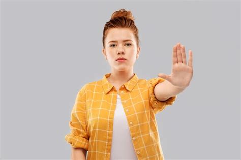 Premium Photo Red Haired Teenage Girl Making Stopping Gesture