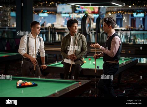Group Of Happy Friends Enjoying Billiard Game Company Of Handsome